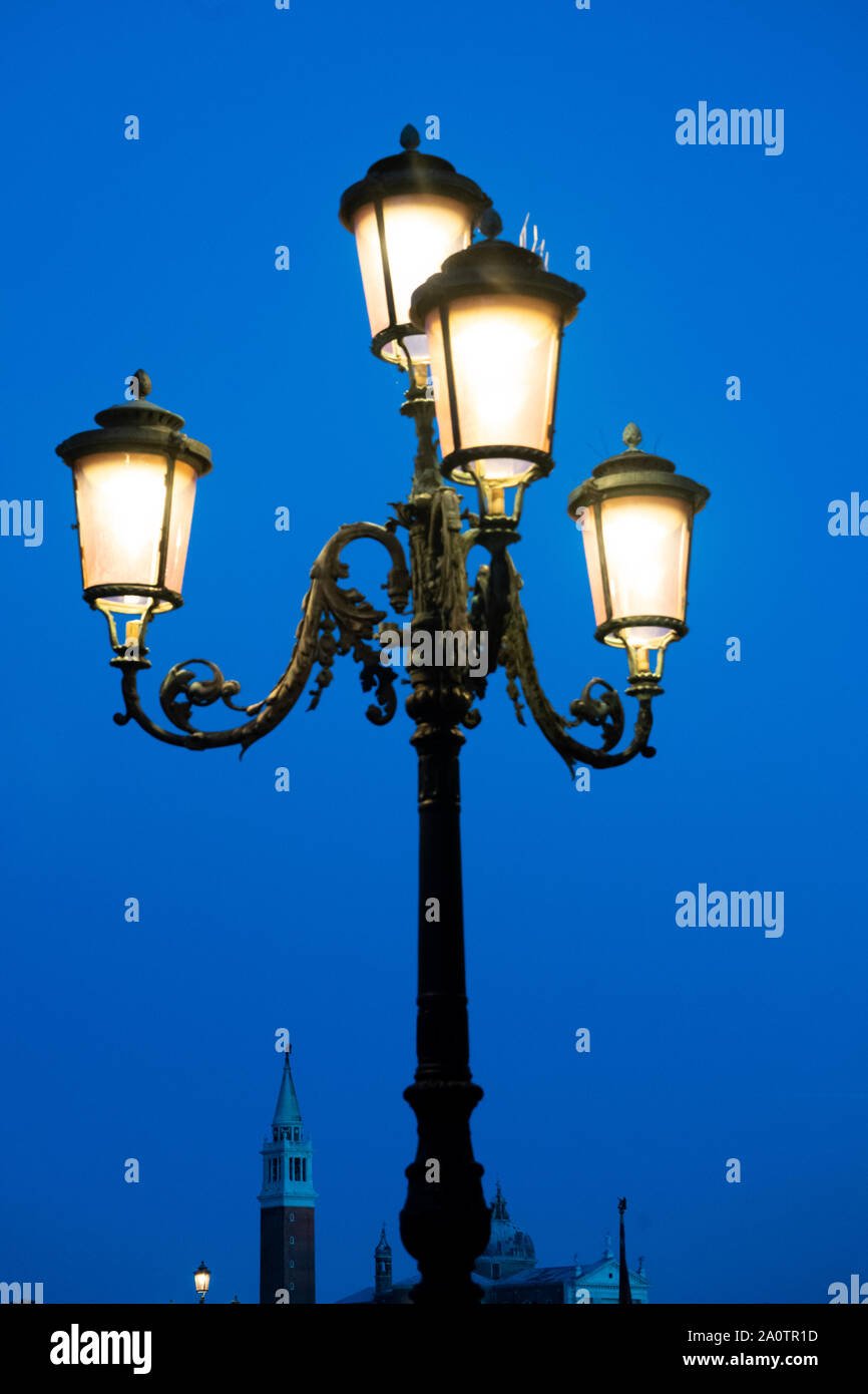 Ornate lamp posts at dusk, St Mark's square, Venice, Italy Stock Photo ...