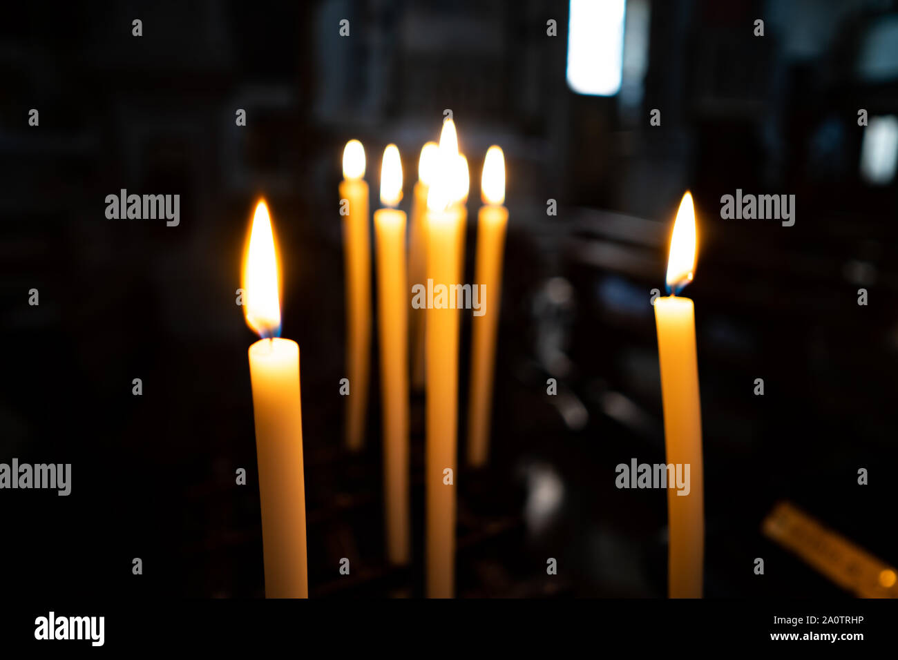 Memorial candles lit in church hi-res stock photography and images - Alamy