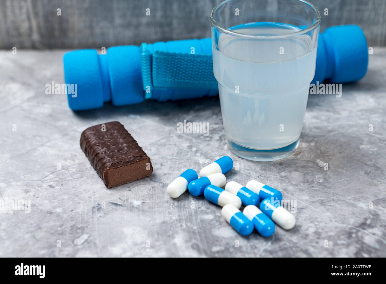 High Protein Bar, BCAA (amino acids) Drink, Creatine capsules and blue ...