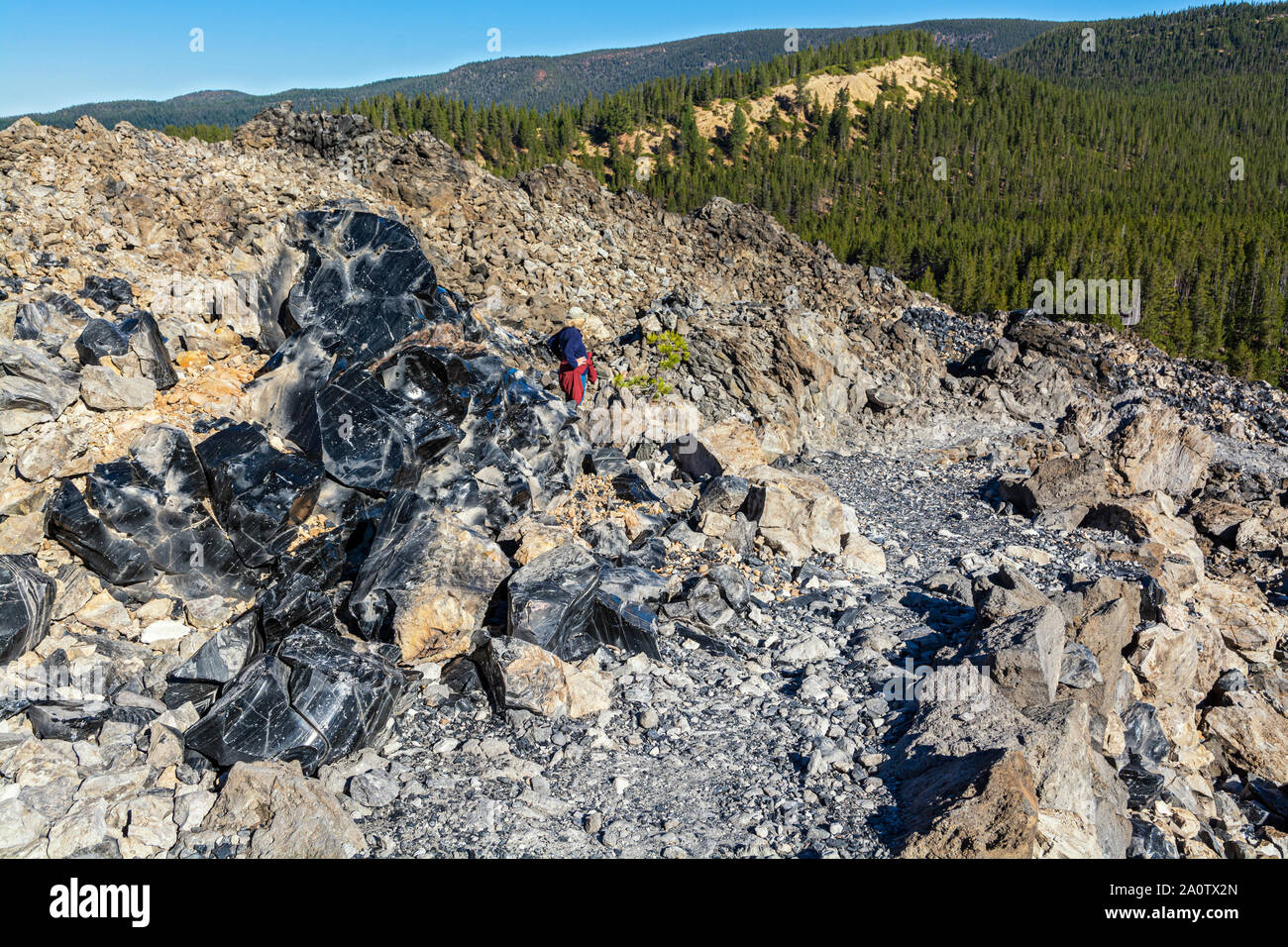 Oregon, Newberry National Volcanic Monument, Big Obsidian Flow Trail, female visitor Stock Photo ...