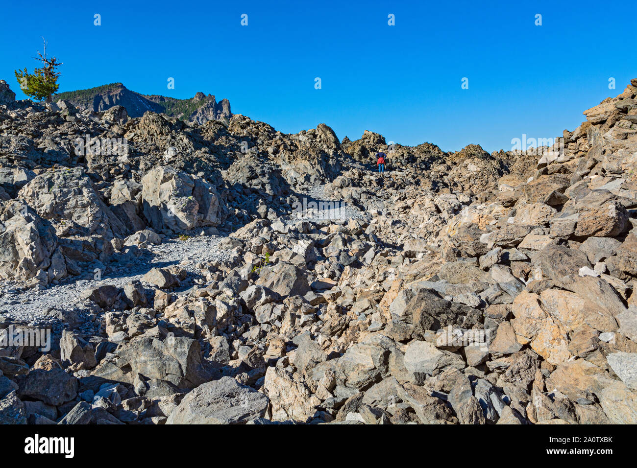 Oregon, Newberry National Volcanic Monument, Big Obsidian Flow Trail, female hiker Stock Photo ...