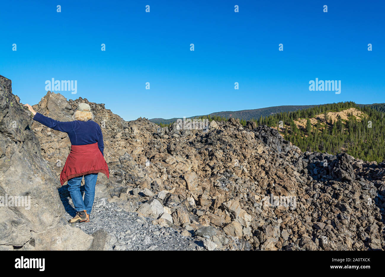 Oregon, Newberry National Volcanic Monument, Big Obsidian Flow Trail, female hiker Stock Photo ...