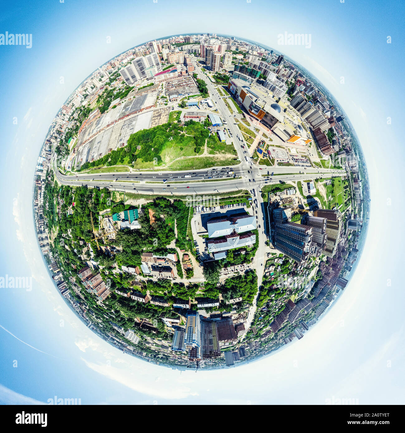 Aerial city view with crossroads and roads, houses, buildings, parks ...
