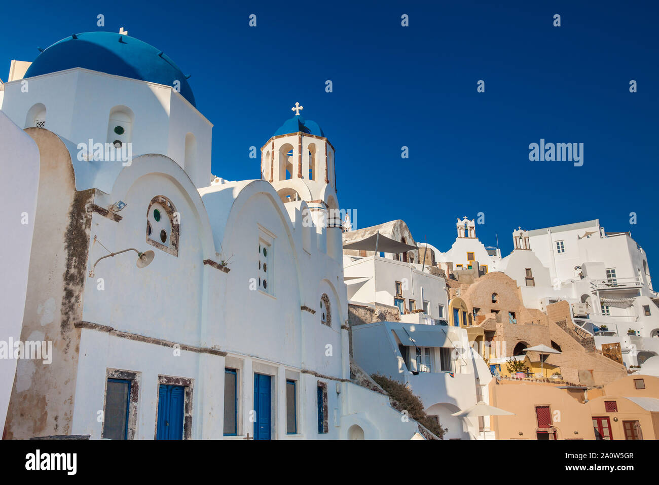 Traditional architecture of the churches of the Oia City in Santorini ...