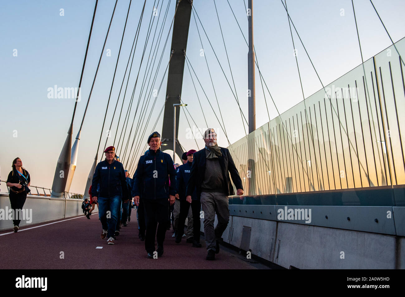 A group of veterans walk at the bridge during the ceremony.This 75 ...