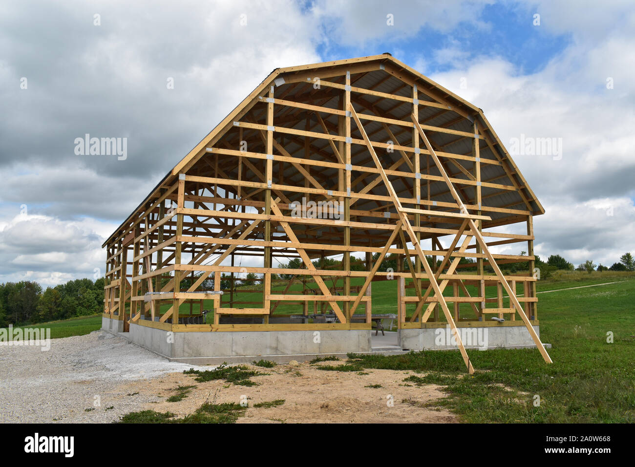 Barn under construction framed and partially complete on a farm in a ...