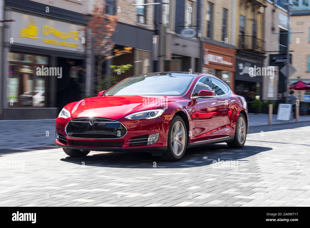 Tesla Model S driving through an urban city centre Stock Photo - Alamy