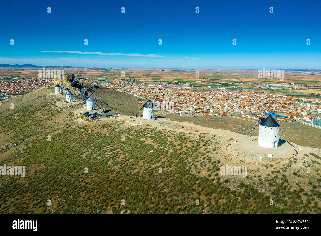 Consuegra castle and windmills aerial view with blue sky in La Mancha ...