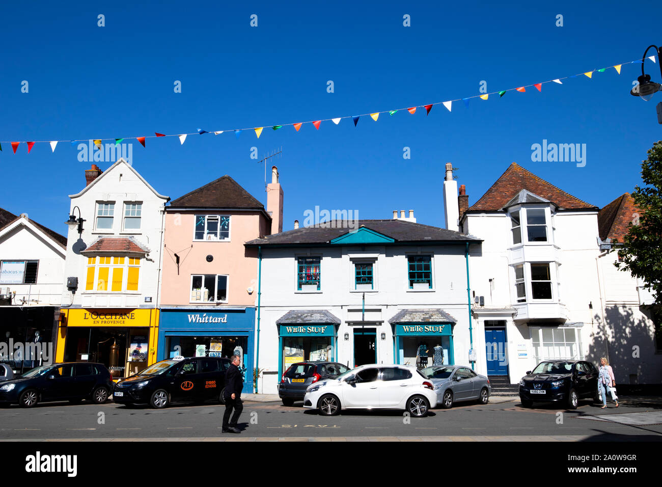 row of retail shops in city centre Stock Photo - Alamy
