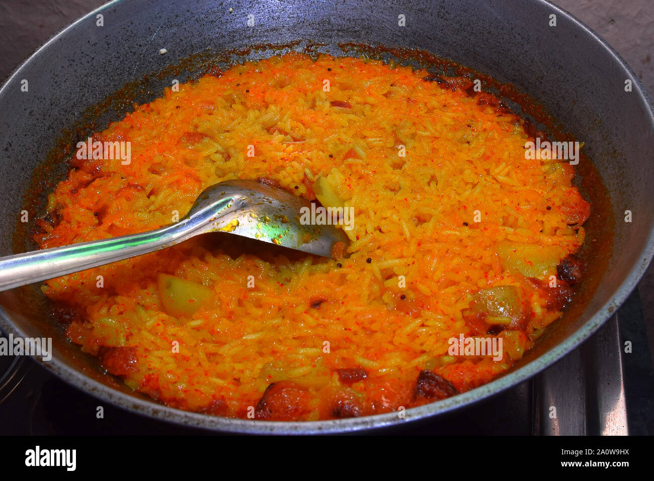 Pilaf or with lamb, and red garnet, in a large cast-iron frying pan ...