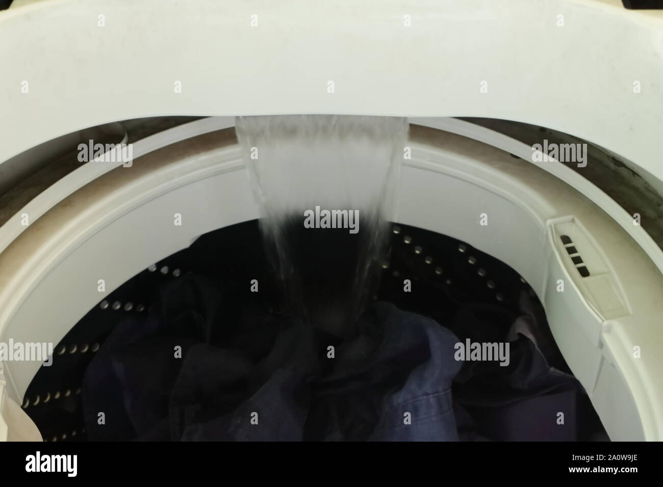 Loading washing machine hi-res stock photography and images - Alamy