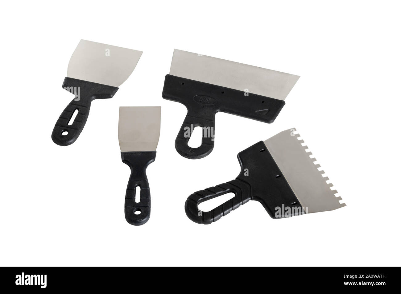 Set of spatulas for finishing work. Close-up. Isolated over white ...