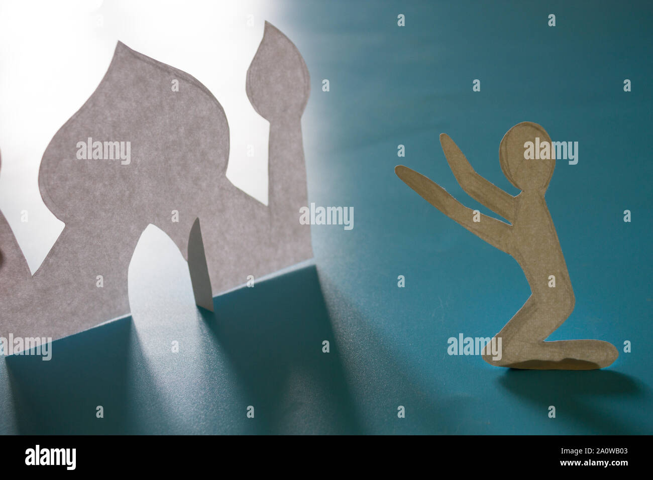 Religious muslim man praying. paper cut concept Stock Photo - Alamy