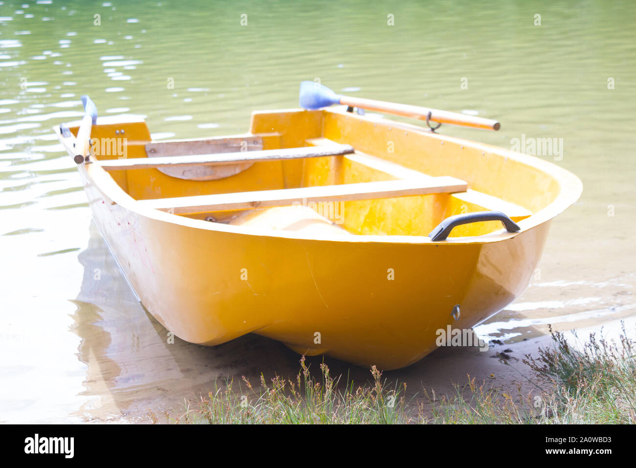 Close up of yellow boat on a coast Stock Photo - Alamy