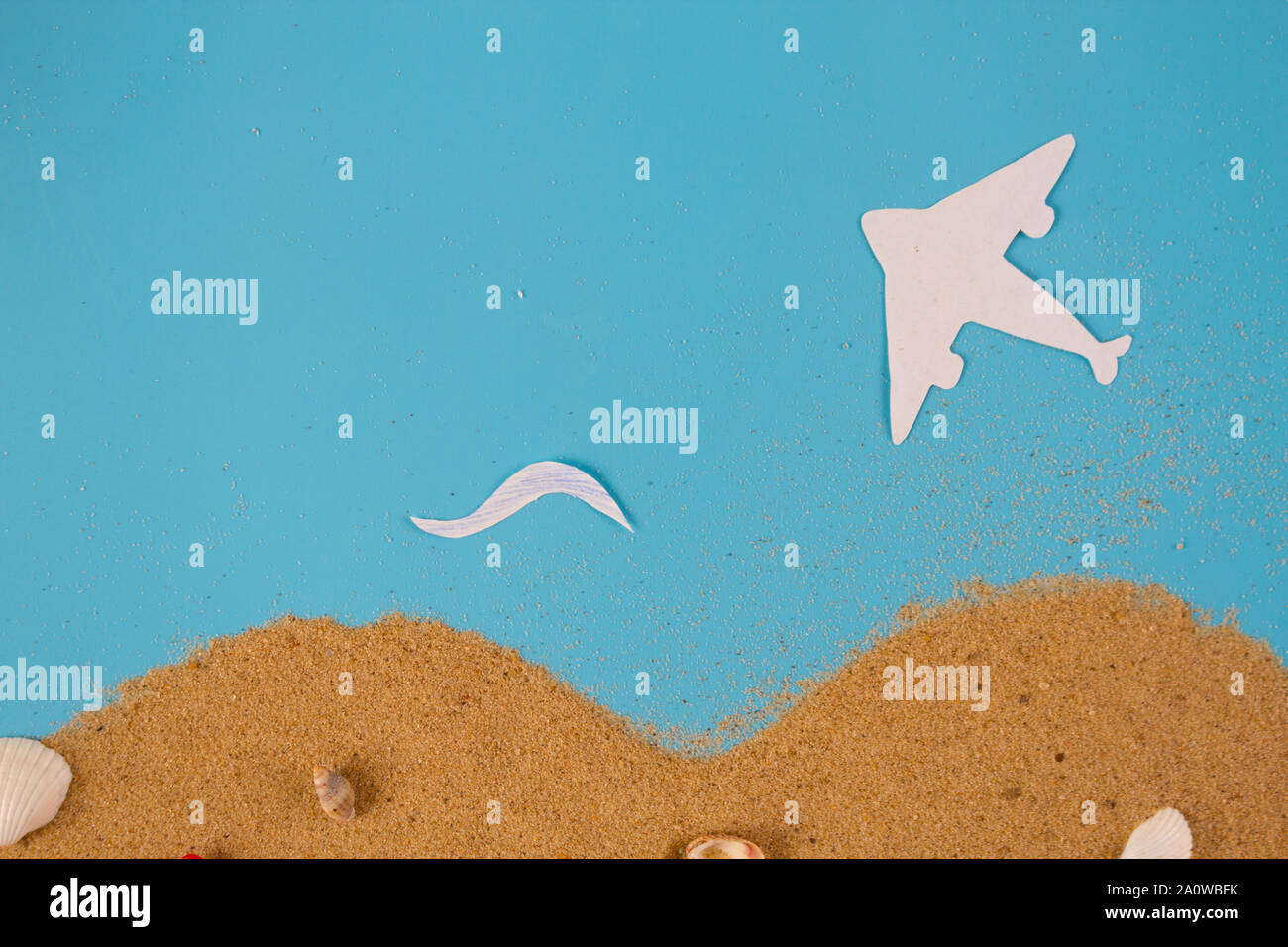 Travel concept image. Paper plane and sand Stock Photo - Alamy