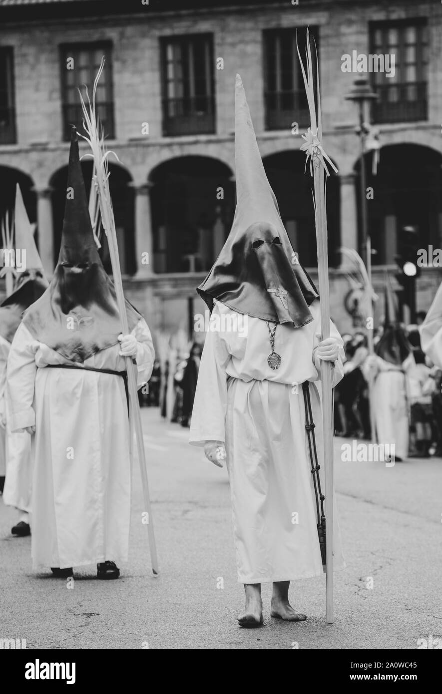 Hooded people in a procession, Holy Week Stock Photo - Alamy