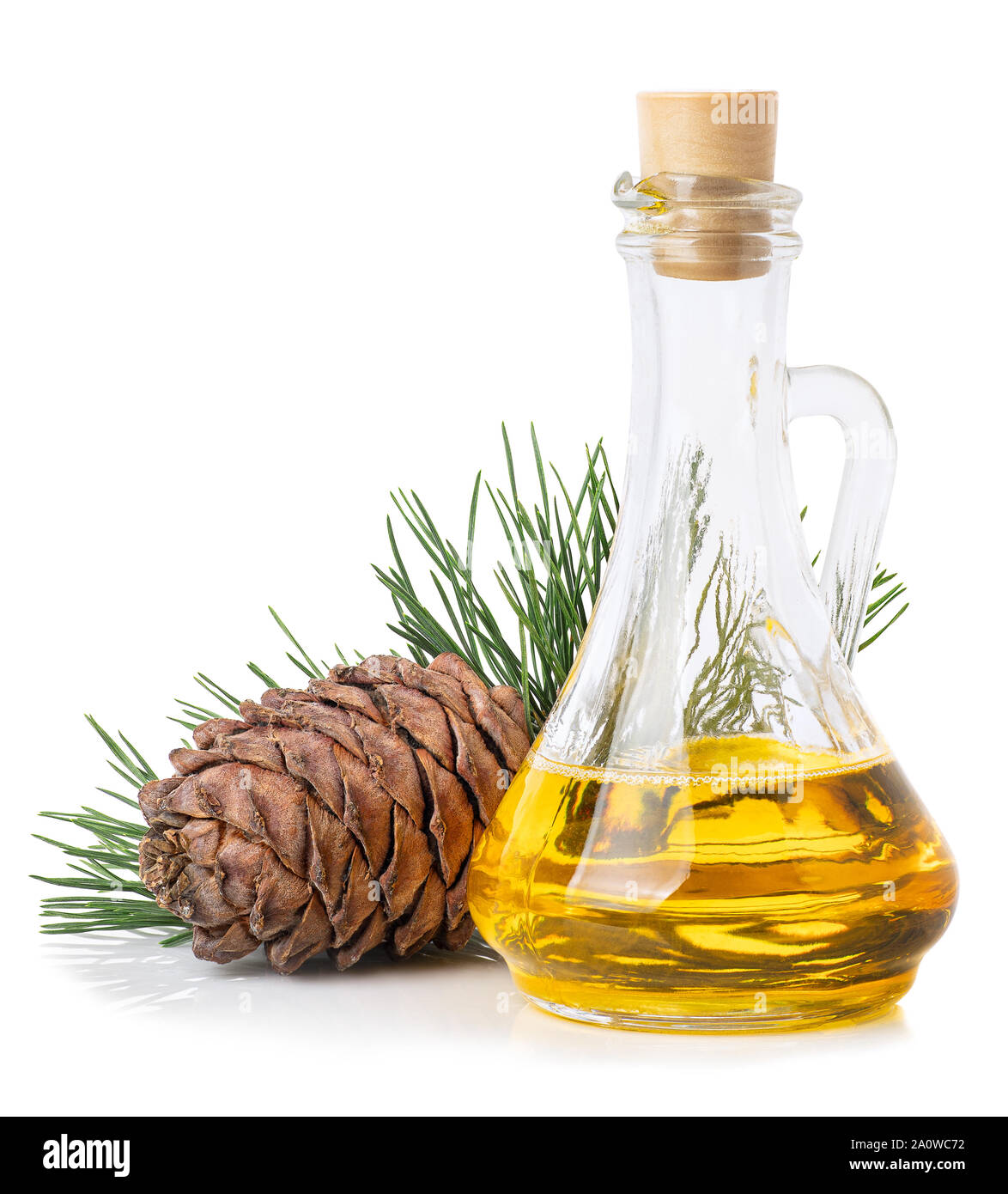 cedar oil in glass bottle with branch and pine cone isolated on white ...