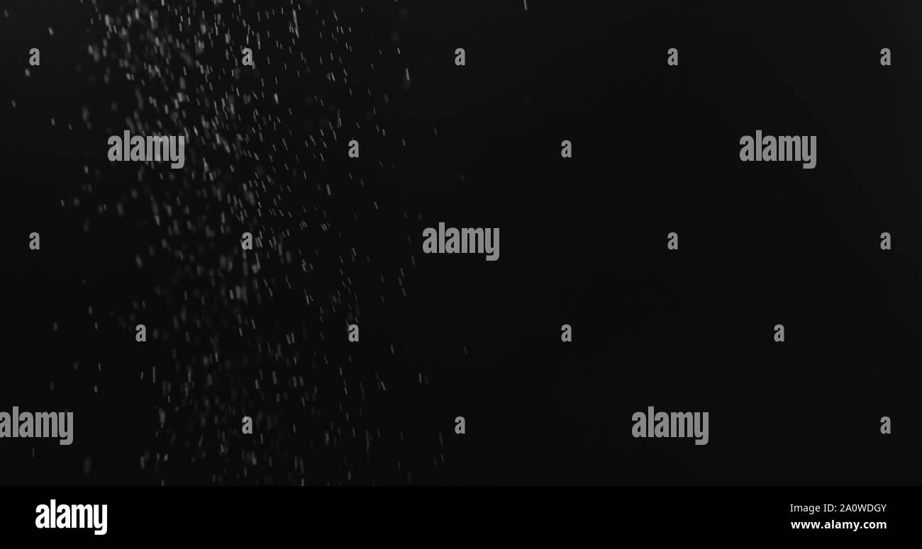 fine dust particles falling on black background, wide photo Stock Photo ...