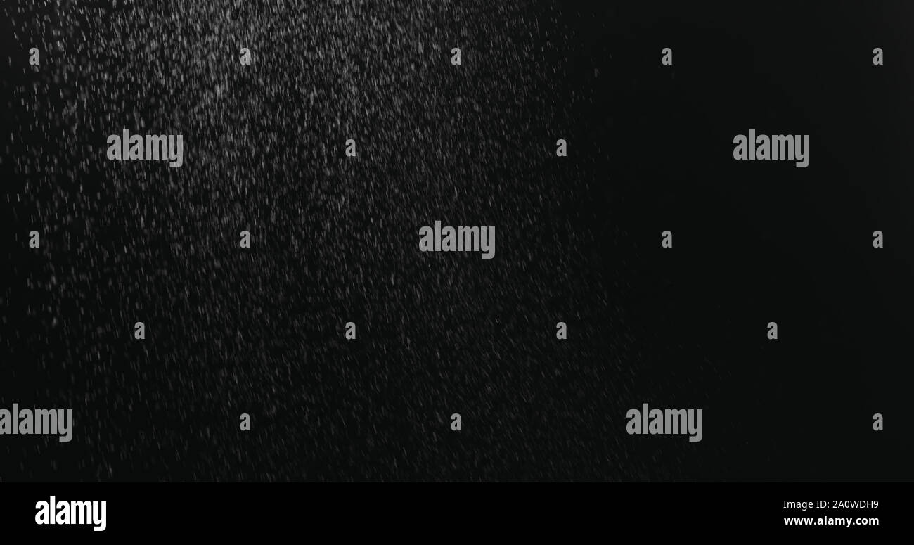 fine dust particles falling on black background, wide photo Stock Photo ...
