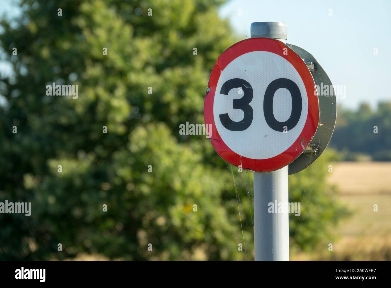 30MPH sign rural country lane Stock Photo - Alamy