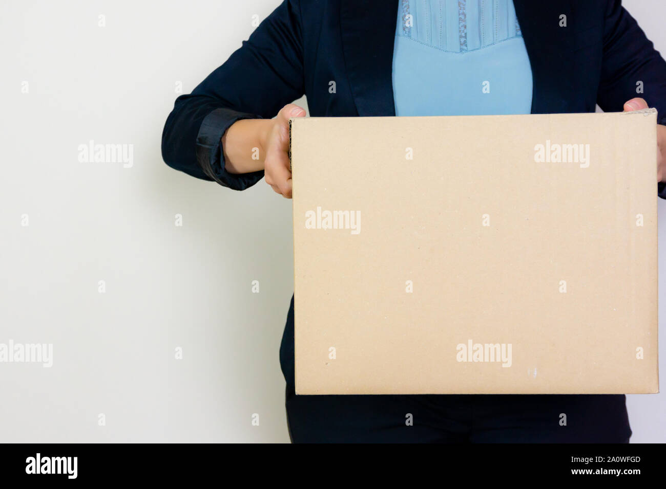 Hands holding cardboard box hi-res stock photography and images - Alamy
