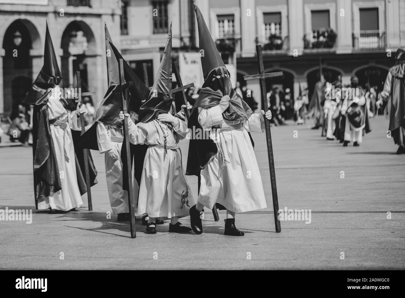 Hooded people in a procession, Holy Week Stock Photo - Alamy
