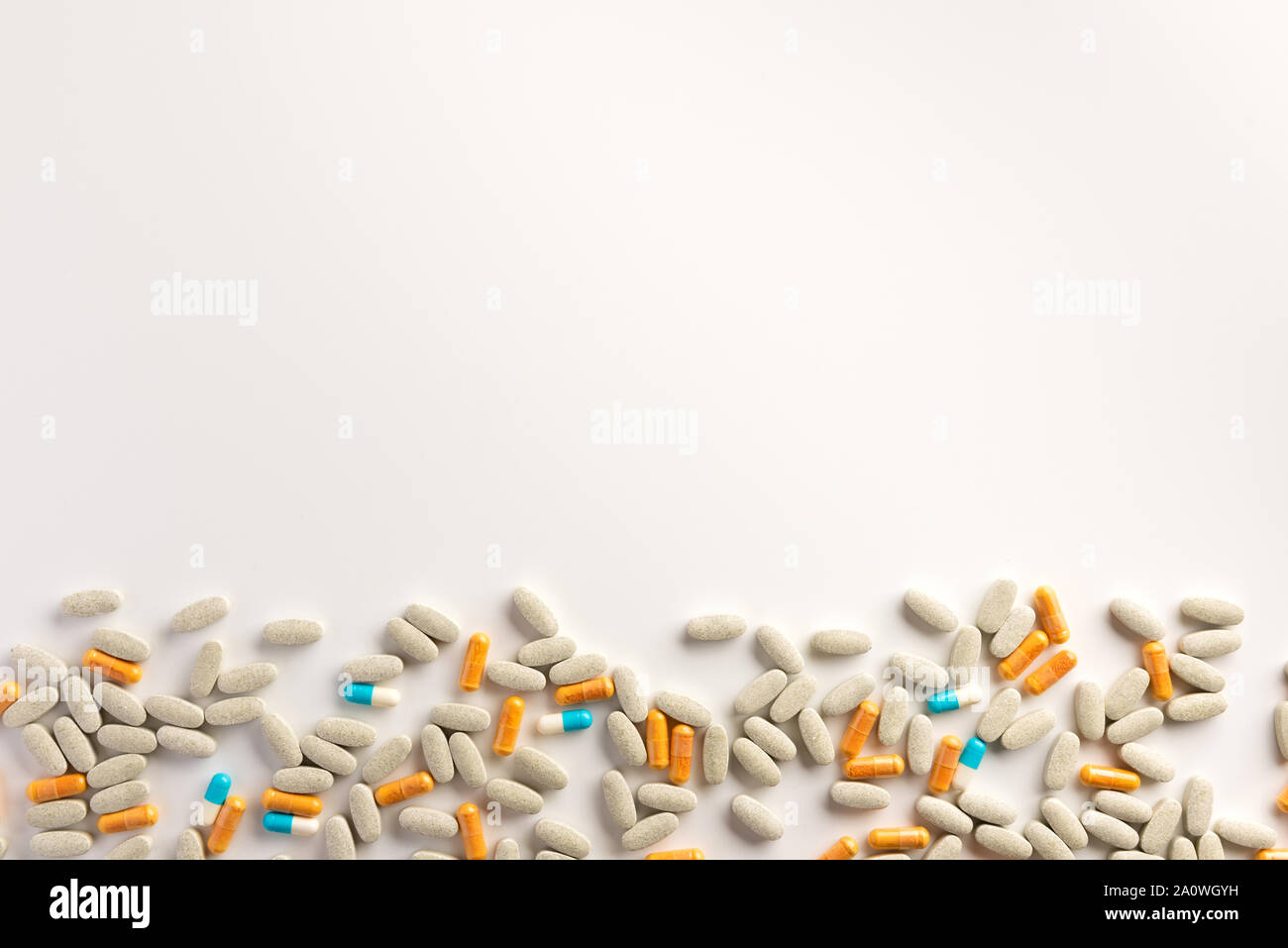 Different pills scattered on white background. Flat lay Stock Photo - Alamy