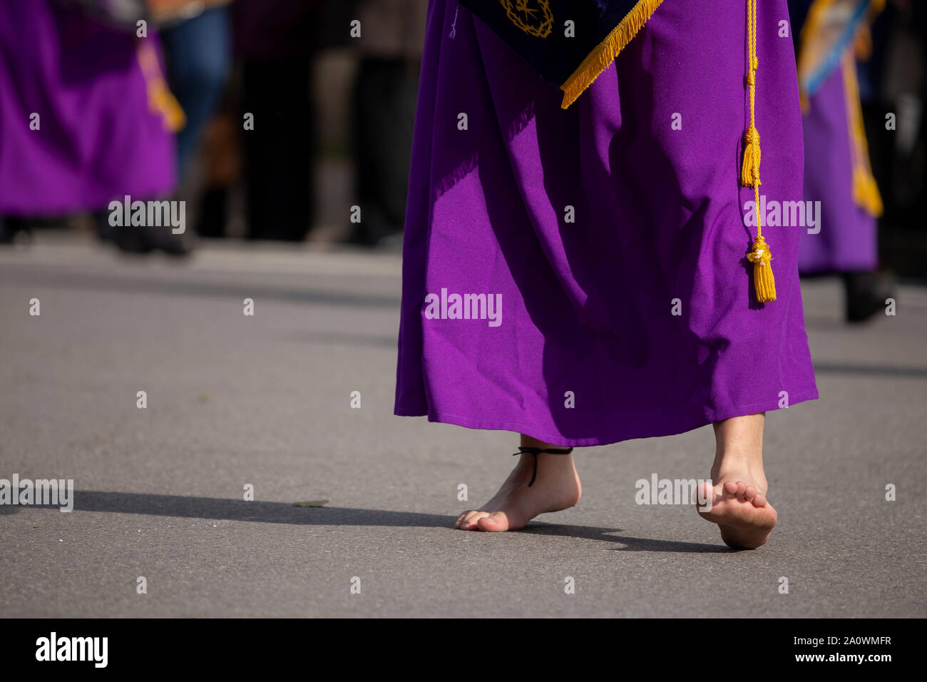 Barefoot man in a procession, Holy Week Stock Photo - Alamy
