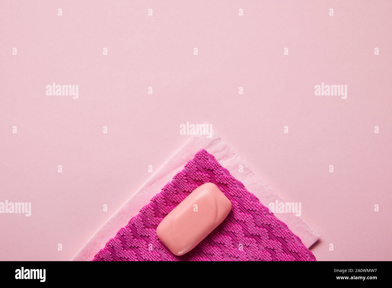 top view of pink rags and soap on pink background Stock Photo - Alamy
