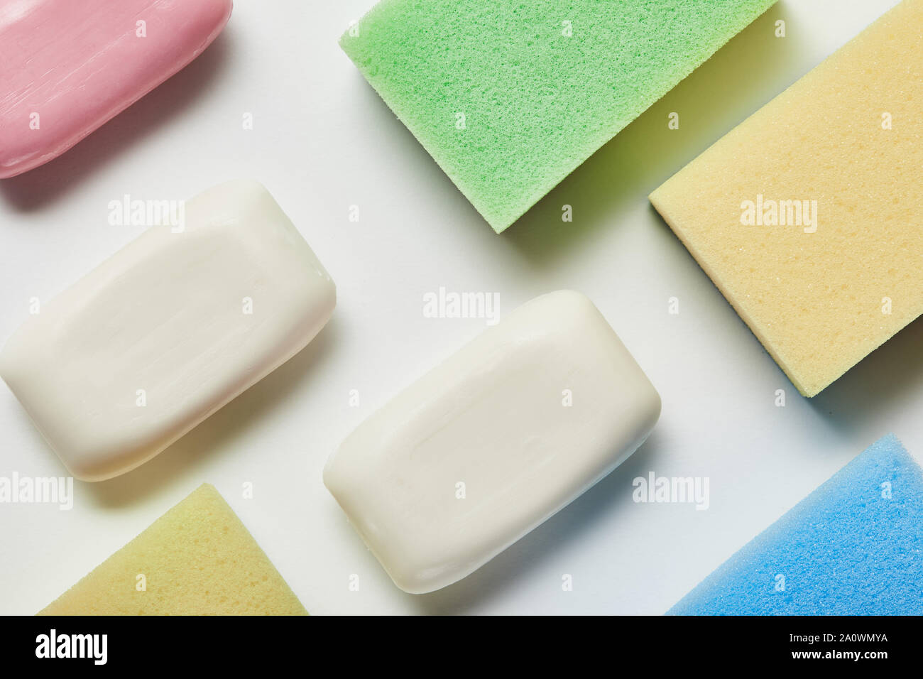 top view of white and pink soaps, colorful and bright sponges Stock ...
