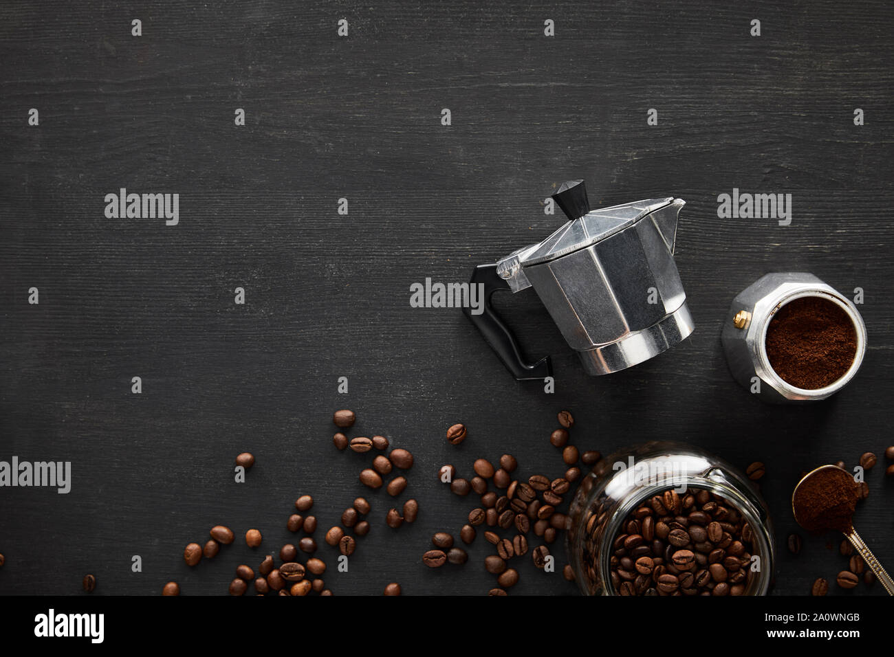 Top view of parts of geyser coffee maker near spoon and glass jar on ...