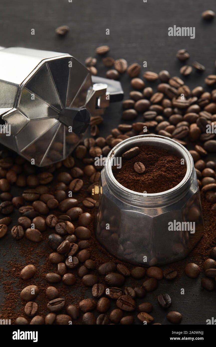 Geyser coffee maker on dark brown wooden surface with coffee beans ...