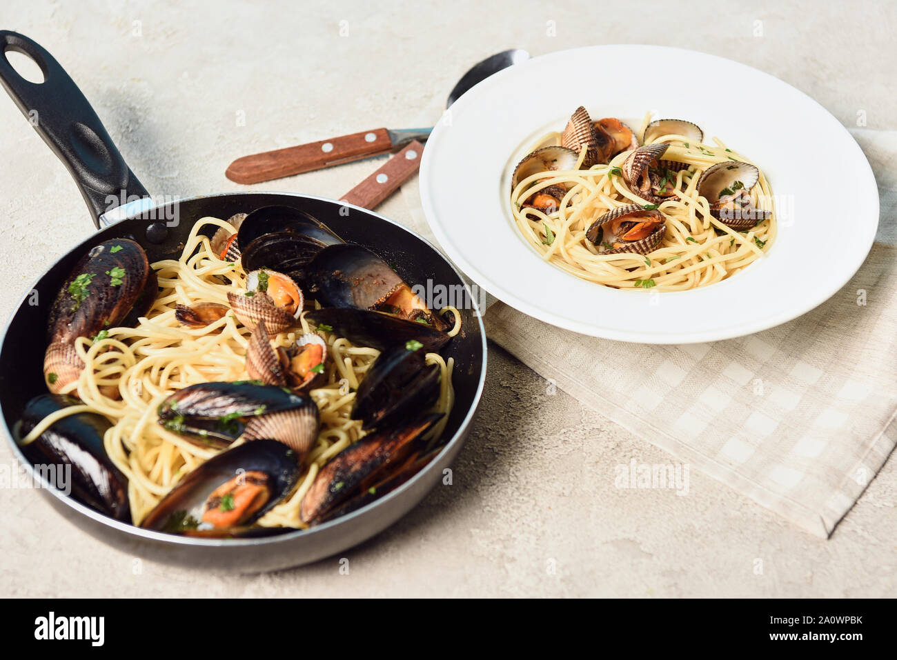 italian delicious pasta with seafood on textured grey background Stock ...