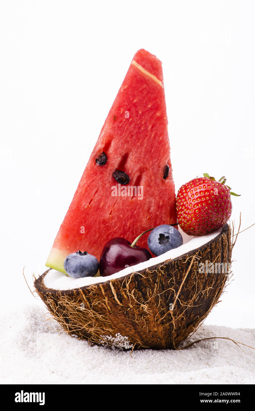 on the coral beach, a coconut contains fresh fruit Stock Photo - Alamy