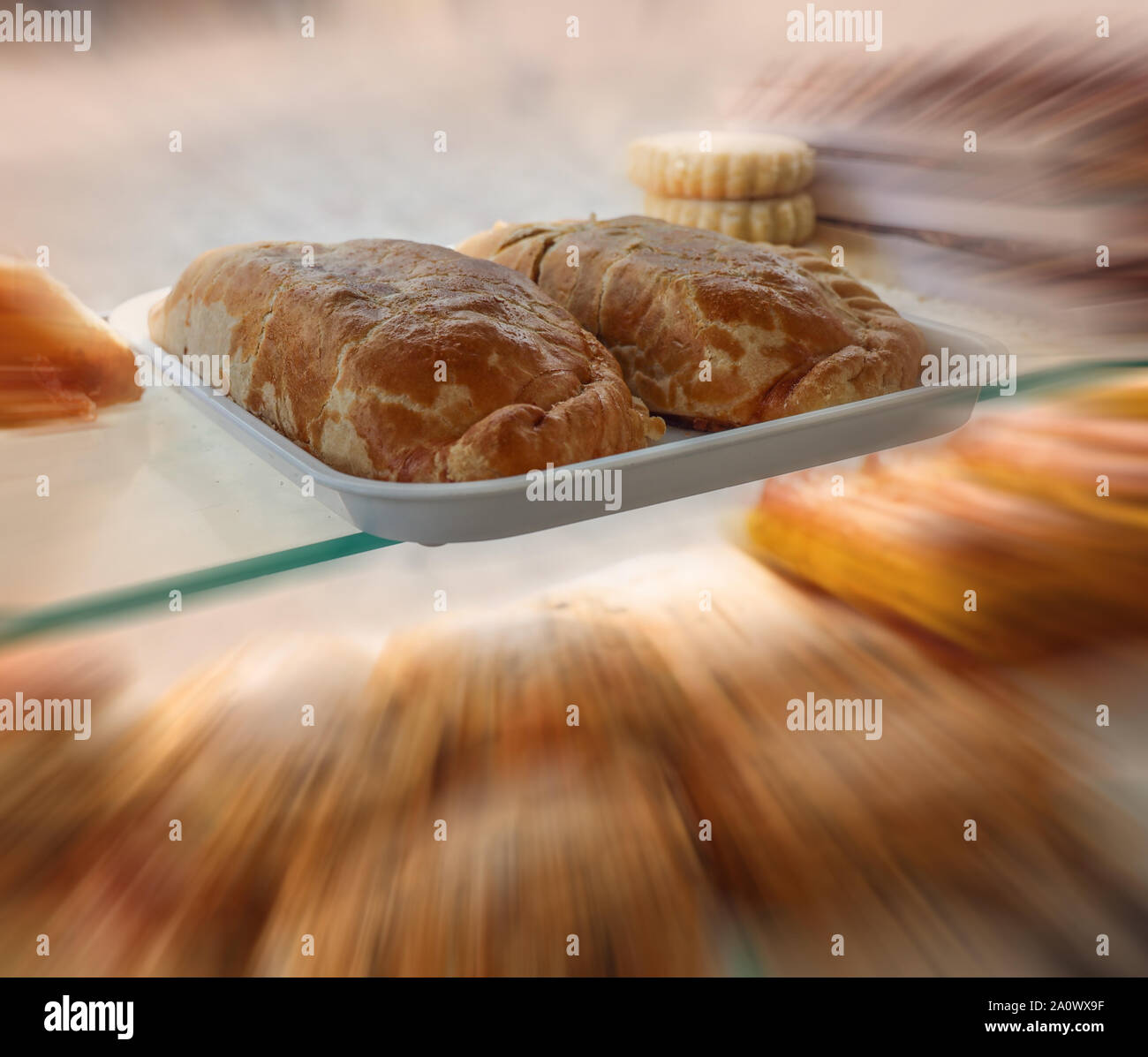 Tempting large pasties in the window of a bakers at St Ives in Cornwall ...