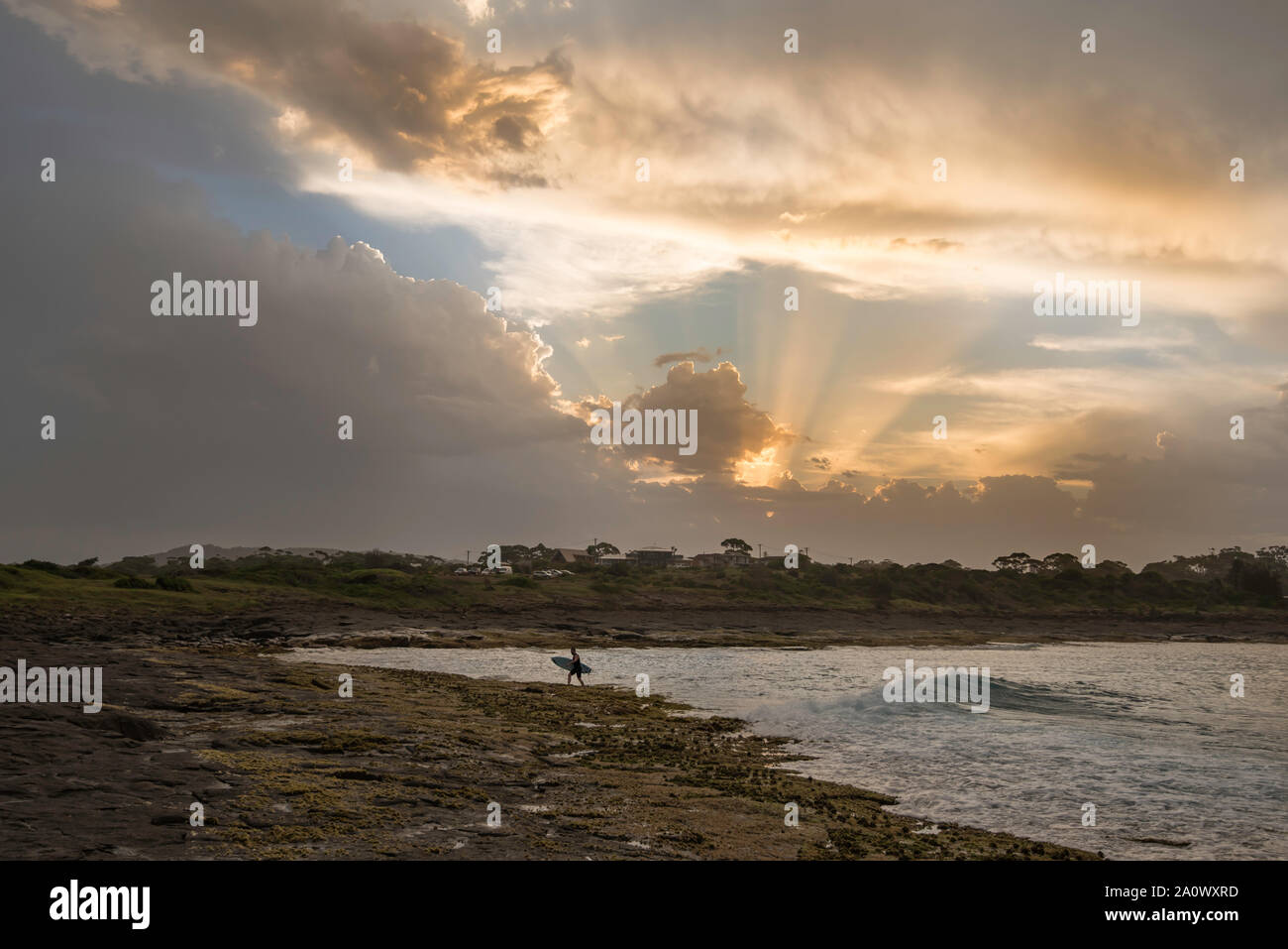 As a storm gathers in the late afternoon, a loan board rider leaves the ...