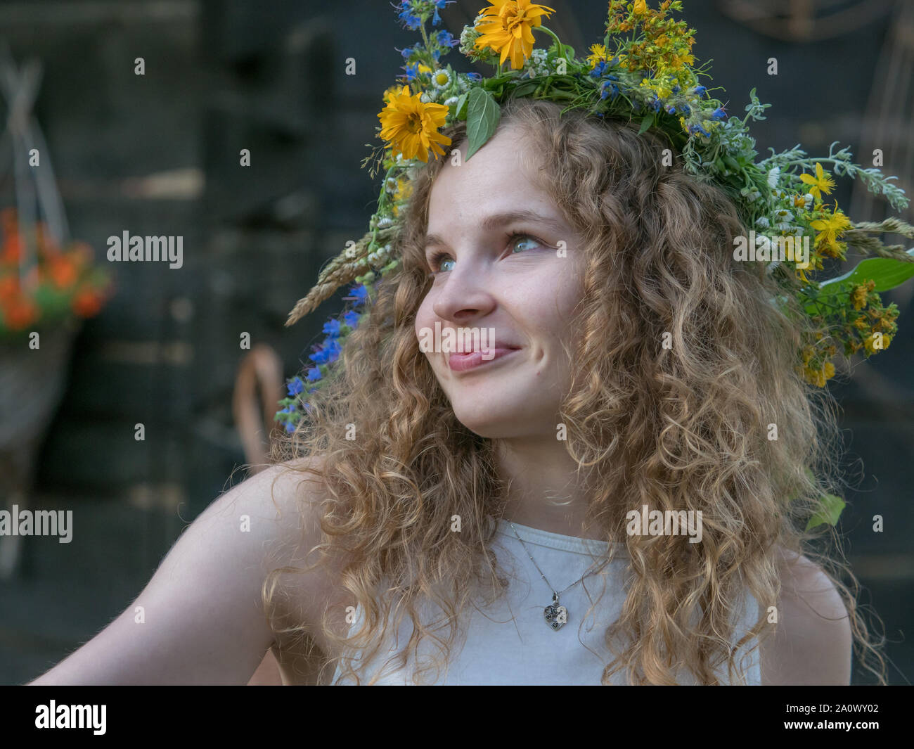 Beautiful girl in wreath of field flowers during Kupala night. Poland ...