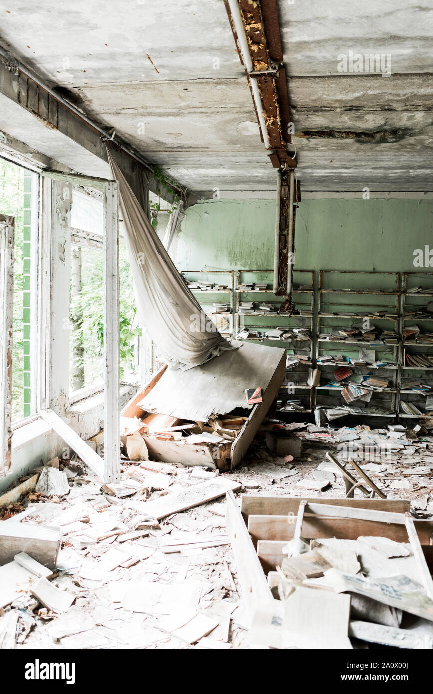 creepy and abandoned library with books on floor in school Stock Photo ...