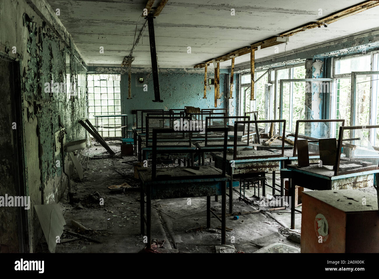 abandoned and creepy classroom with dirty tables in school Stock Photo ...