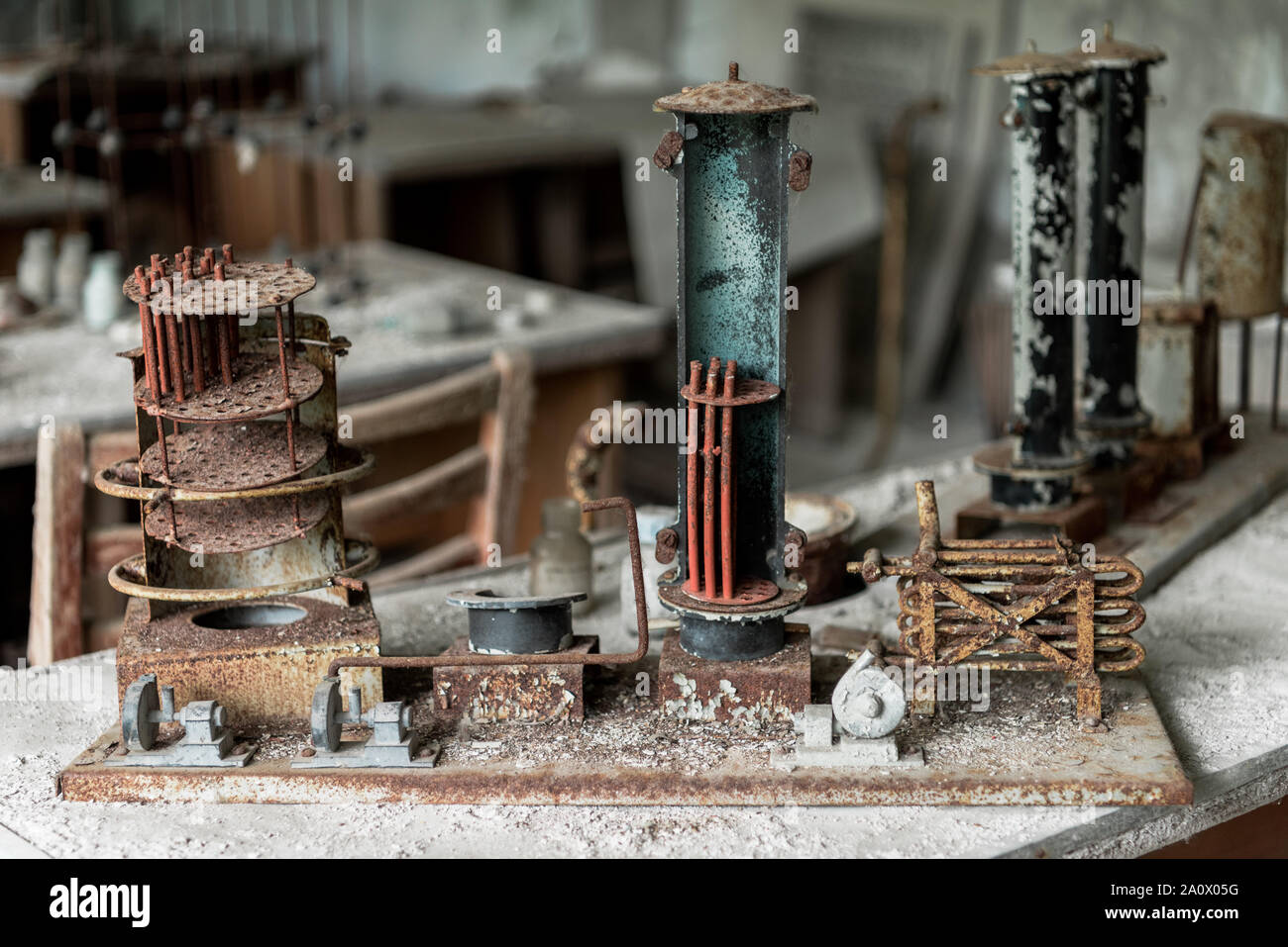 abandoned small metallic construction on dirty table Stock Photo - Alamy