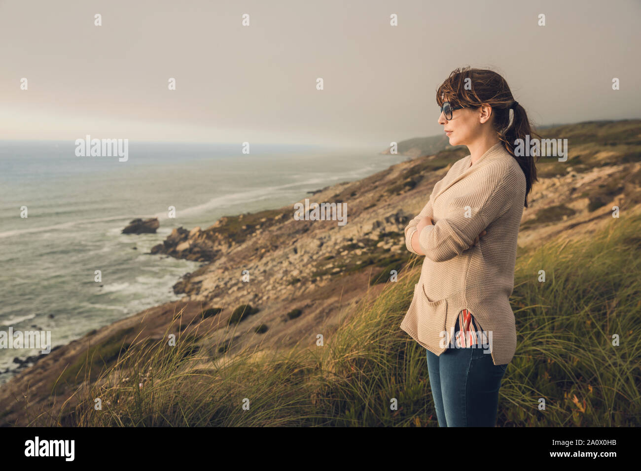 Woman in nature thinking about life Stock Photo - Alamy