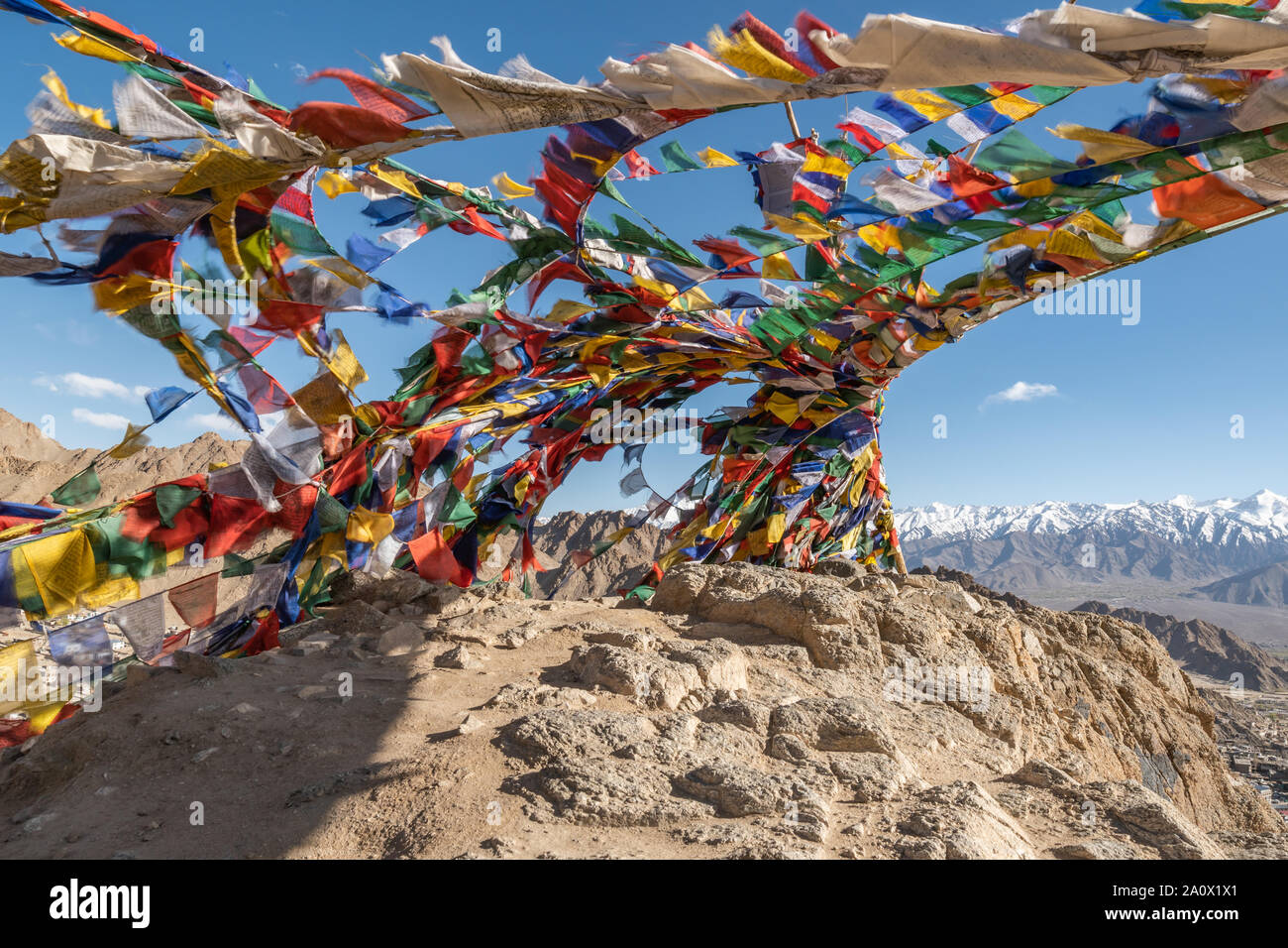 Colorful prayer flags on rock mountain in Leh Ladakh, India Stock Photo ...