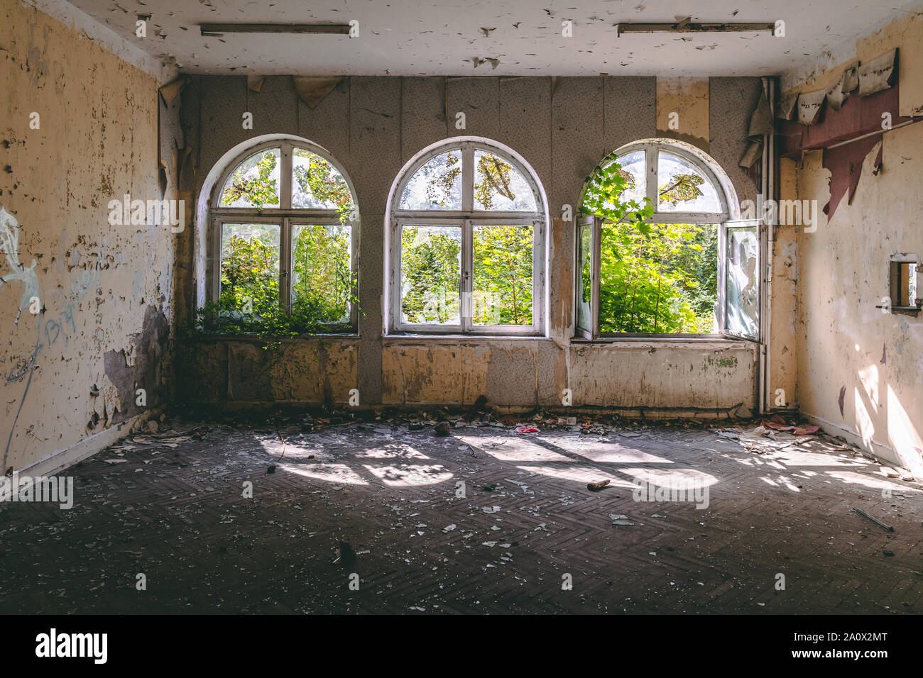 Old abandoned classroom with three big windows Stock Photo - Alamy