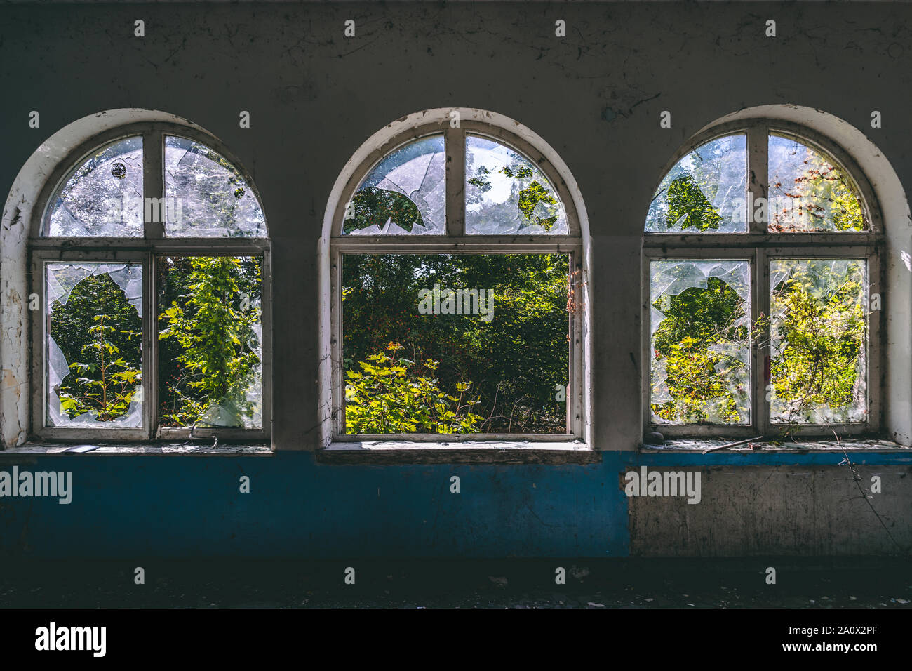 three old destroyed windows. the middle window is almost completely ...