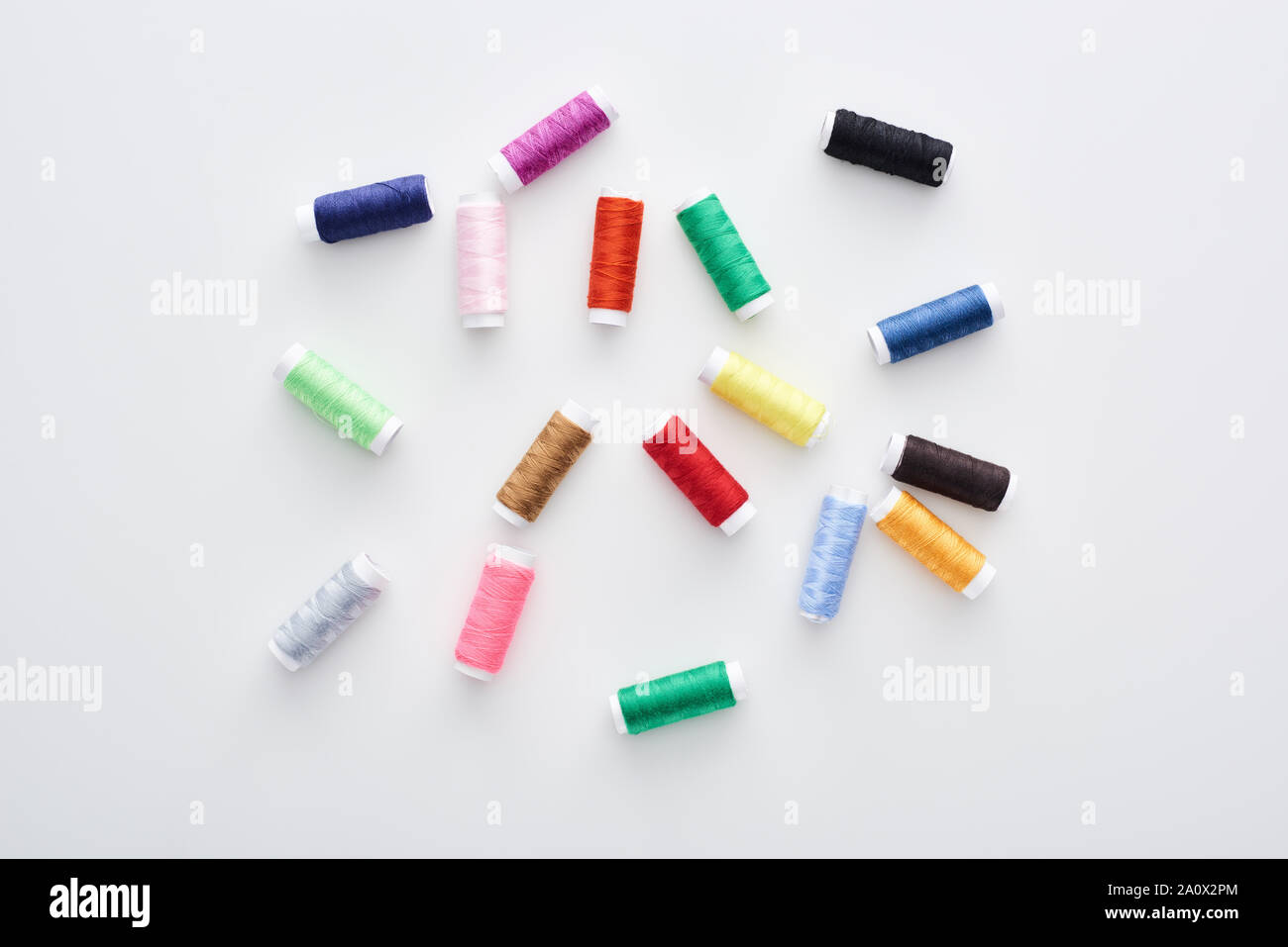 top view of bright and colorful threads on white background Stock Photo ...