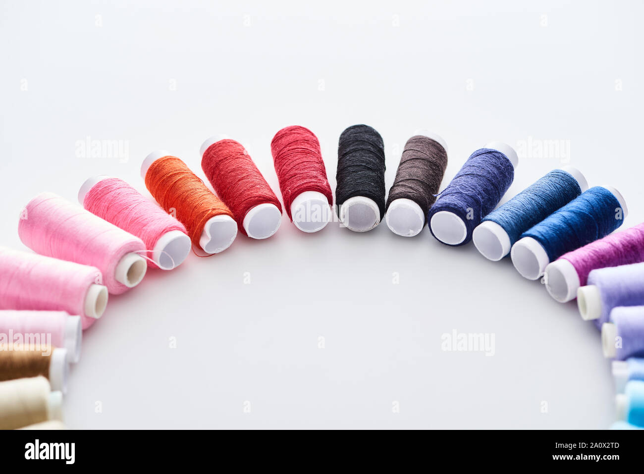 flat lay with bright and colorful threads on white background Stock ...