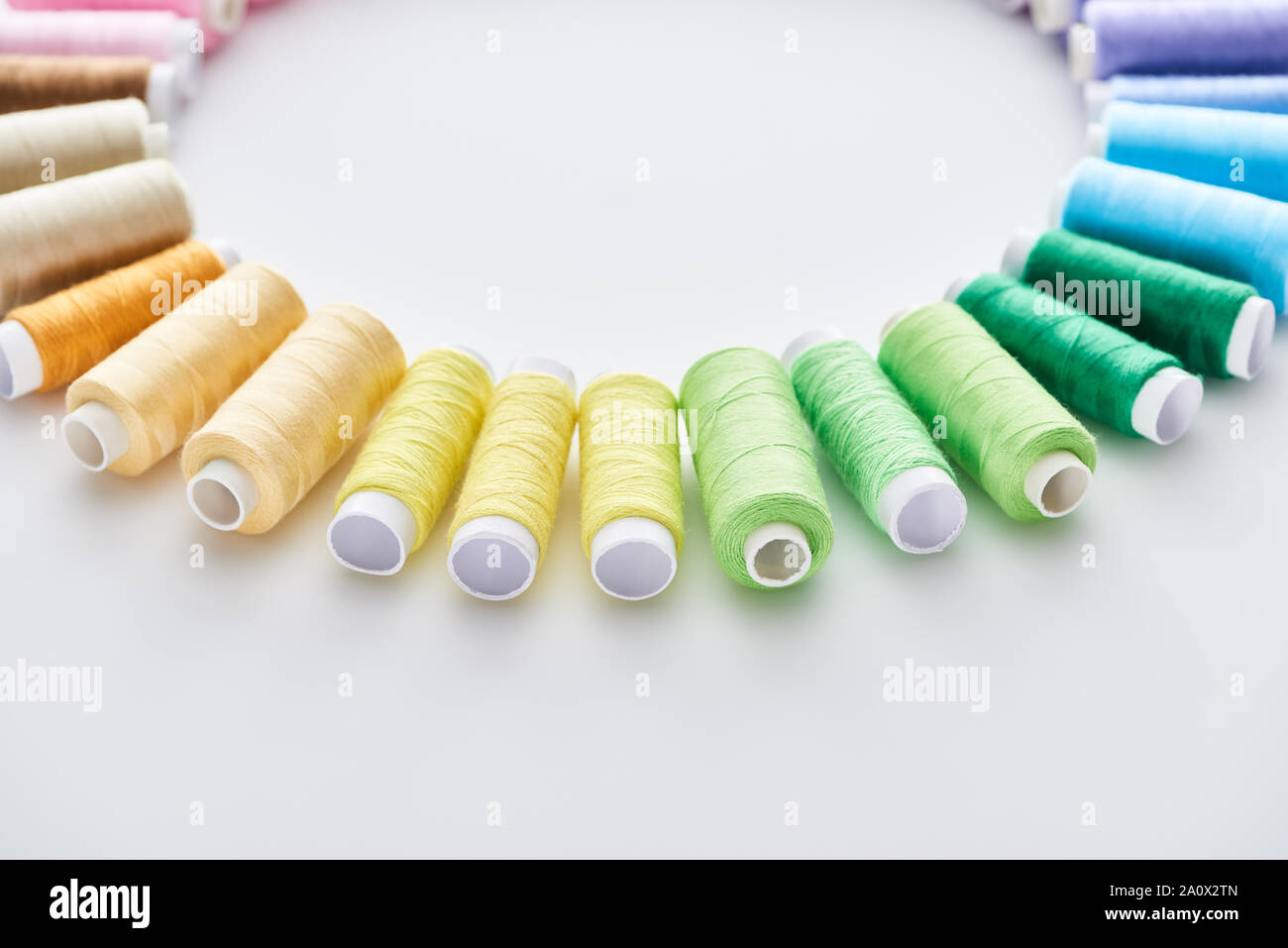 flat lay with bright and colorful threads on white background Stock ...