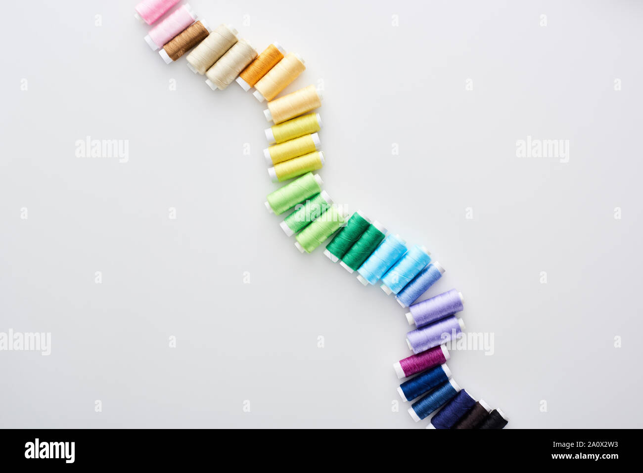 top view of bright and colorful threads on white background Stock Photo ...