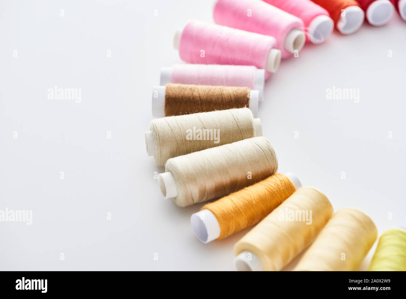 flat lay with bright and colorful threads on white background Stock ...