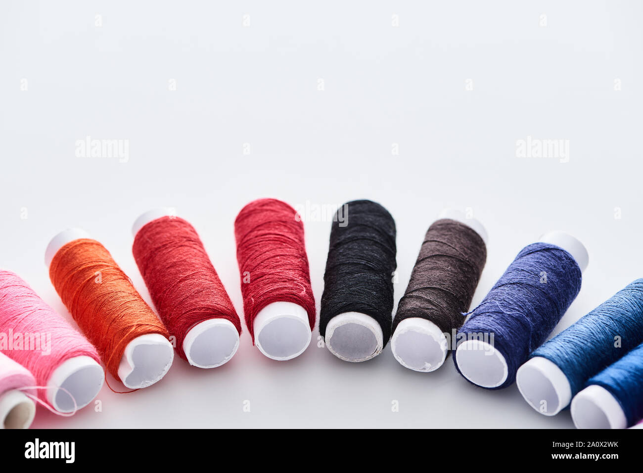 flat lay with bright and colorful threads on white background Stock ...